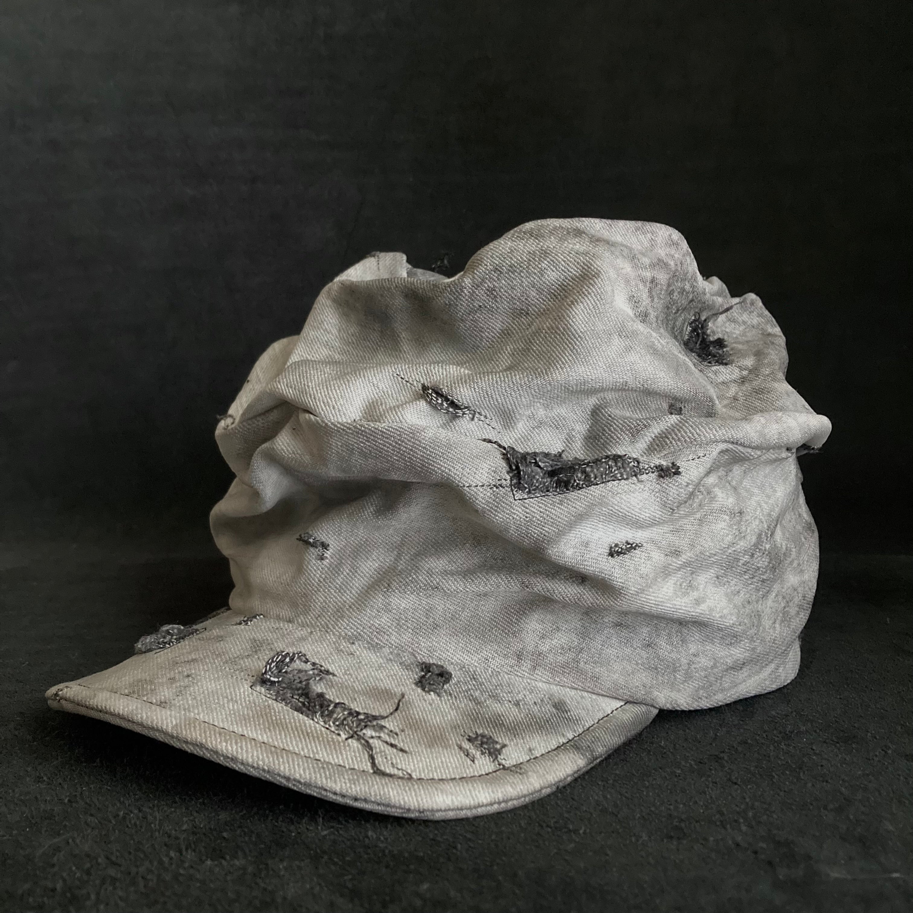 Hard bleached white/black denim turn cap – triangles hat